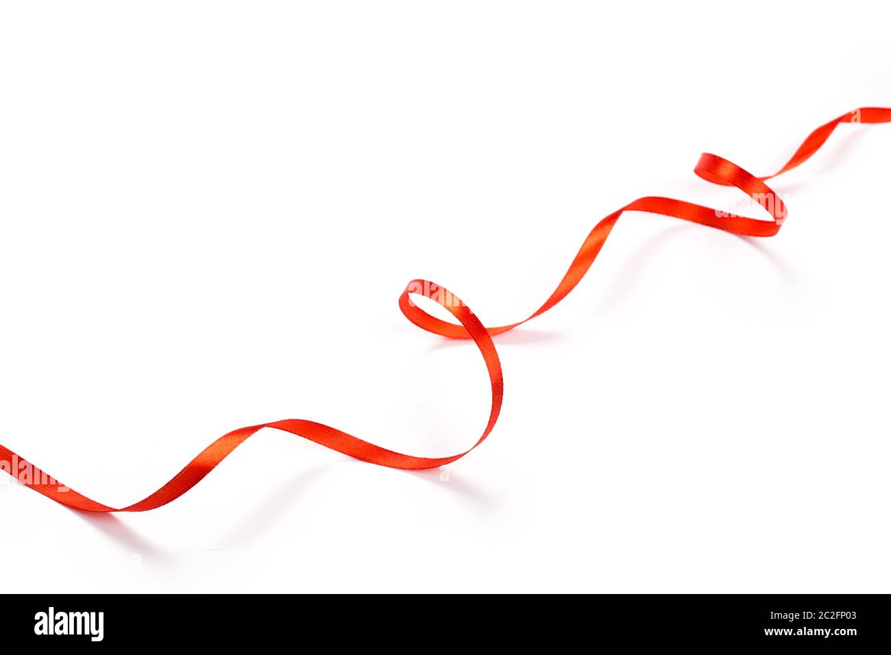 Red ribbon isolated on white background Stock Photo - Alamy