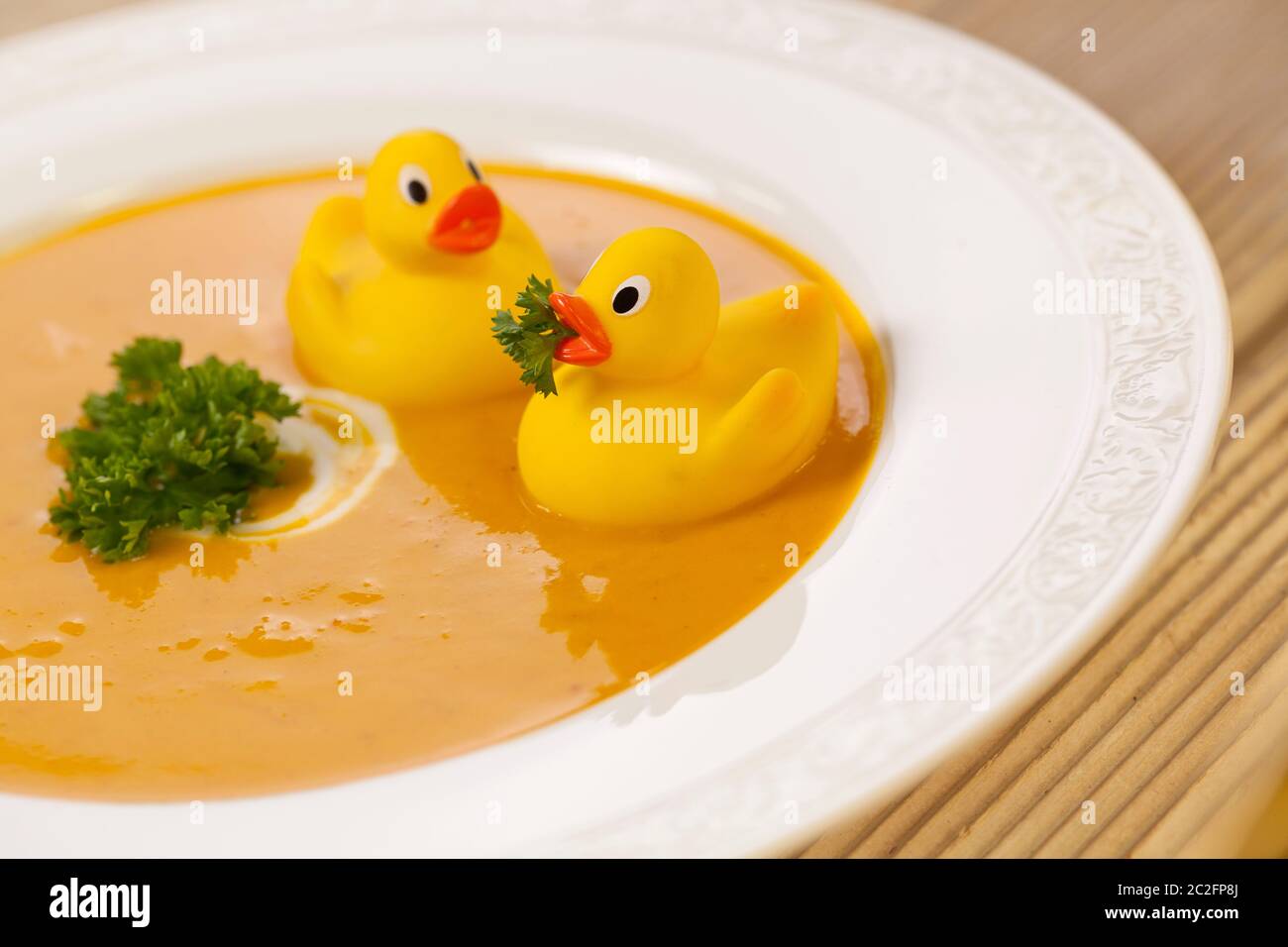 funny pumpkin soup still life with swimming rubber duck Stock Photo - Alamy