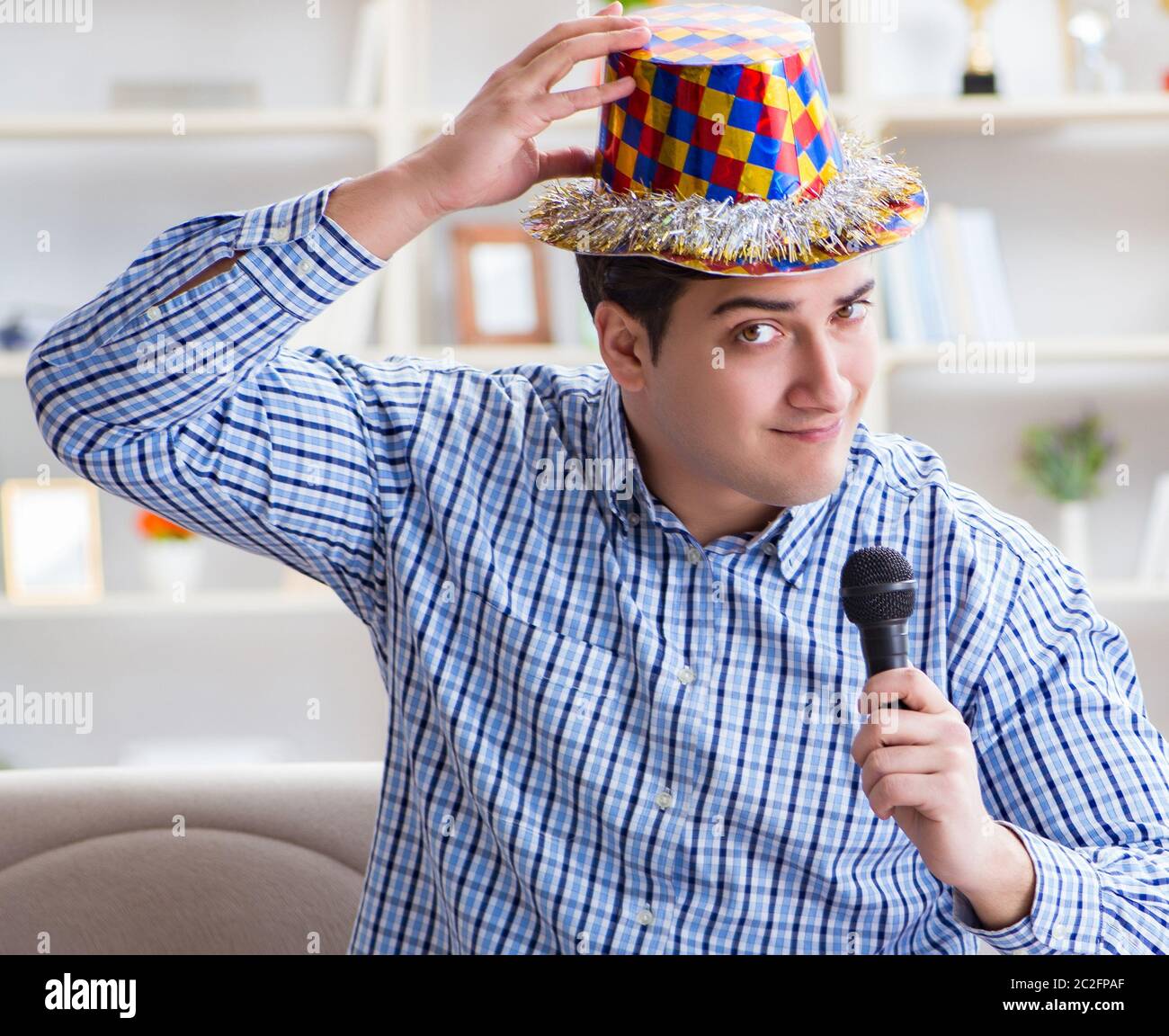 Funny man singing songs in karaoke at home Stock Photo - Alamy