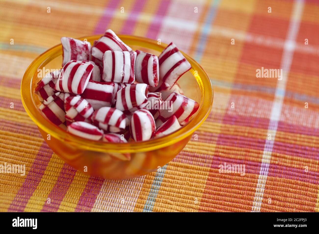 colorful sweet treats, red white peppermint candies in a bowl Stock ...