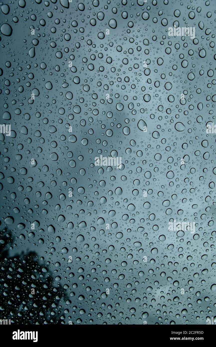 Natural pattern of water drops on window glass during rainy weather ...