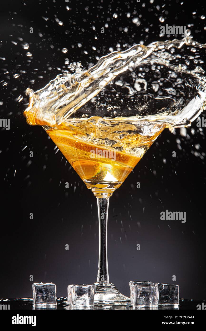 Splash orange juice falling glass hi-res stock photography and images ...