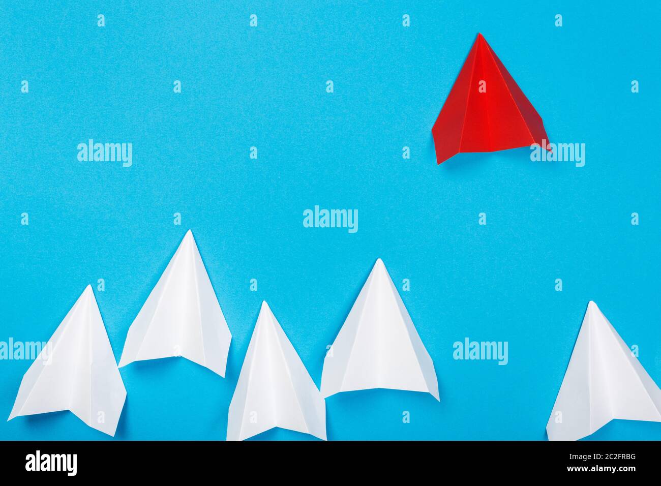 Red paper plane are different from others on blue background. Think ... Red paper plane are different from others on blue background. Think ...
