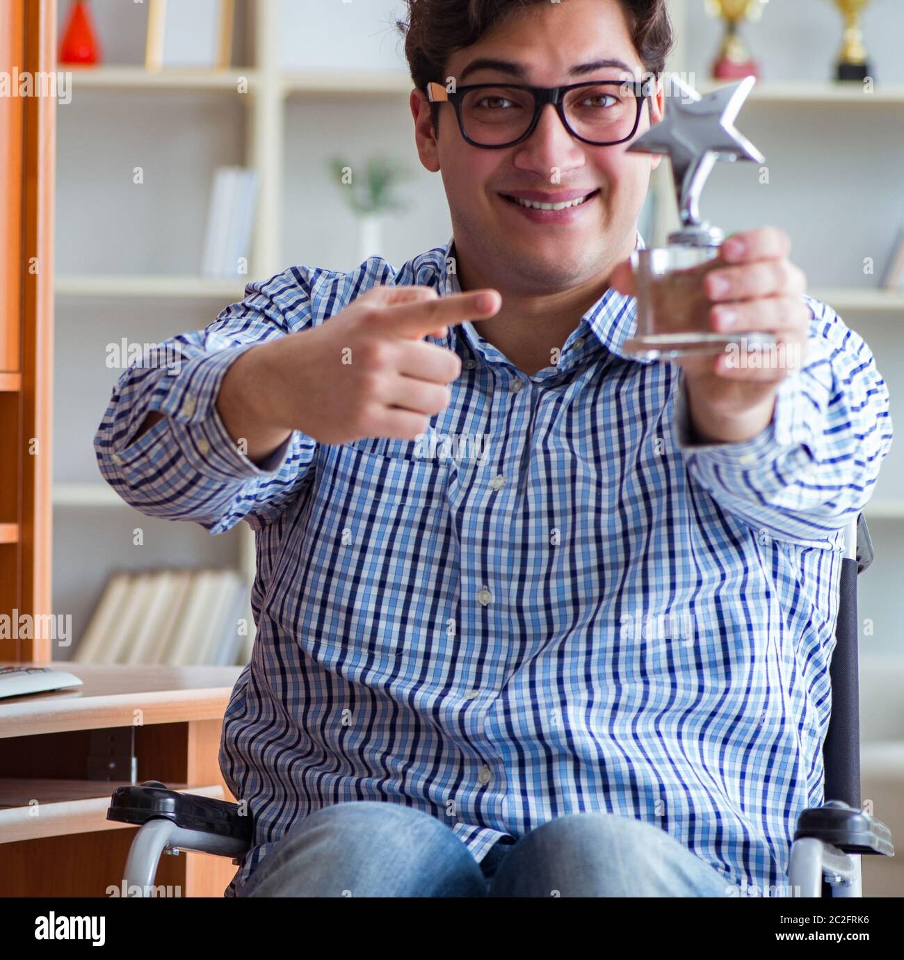 Disabled student studying at home on wheelchair Stock Photo - Alamy