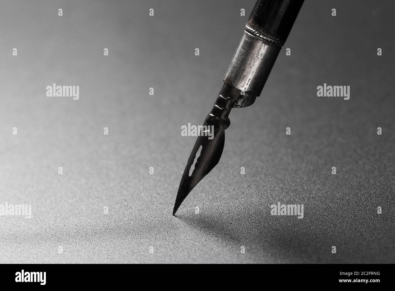 Old fountain pen on a black textured background Stock Photo - Alamy
