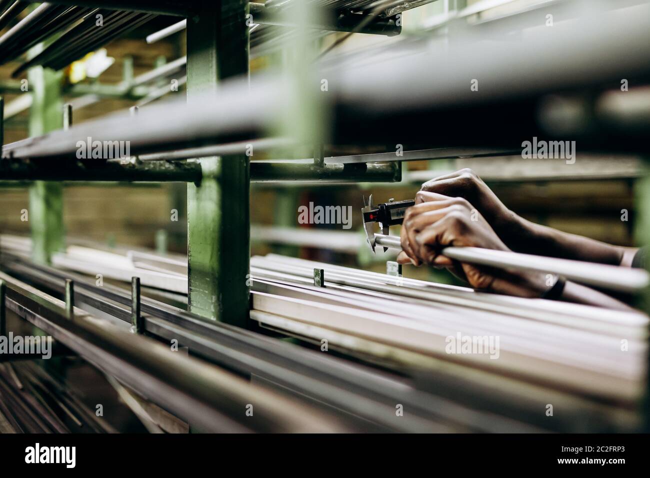 Iron and steel materials in different shape and forms lying on shelves ...