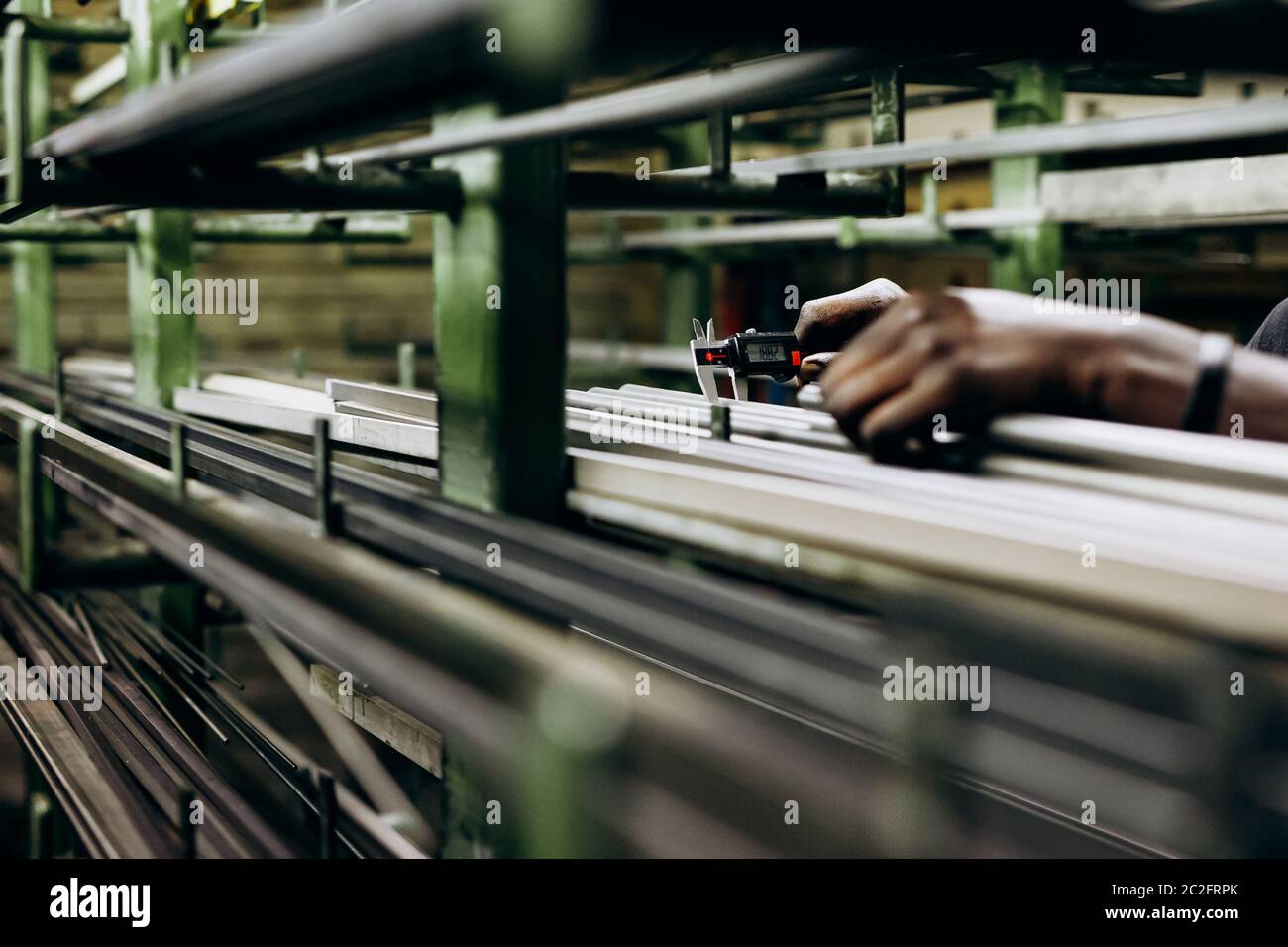 Structural materials on shelves in building warehouse. Different shapes ...