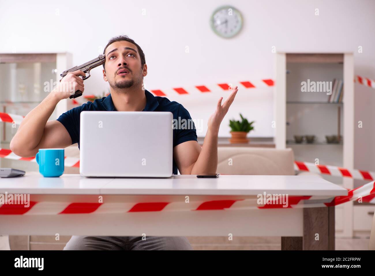 Young man feeling bored at the home in self-isolation concept Stock ...