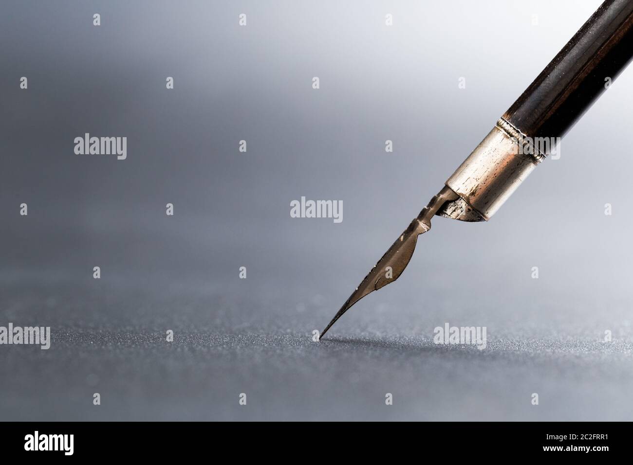 Old fountain pen on a black textured background Stock Photo - Alamy