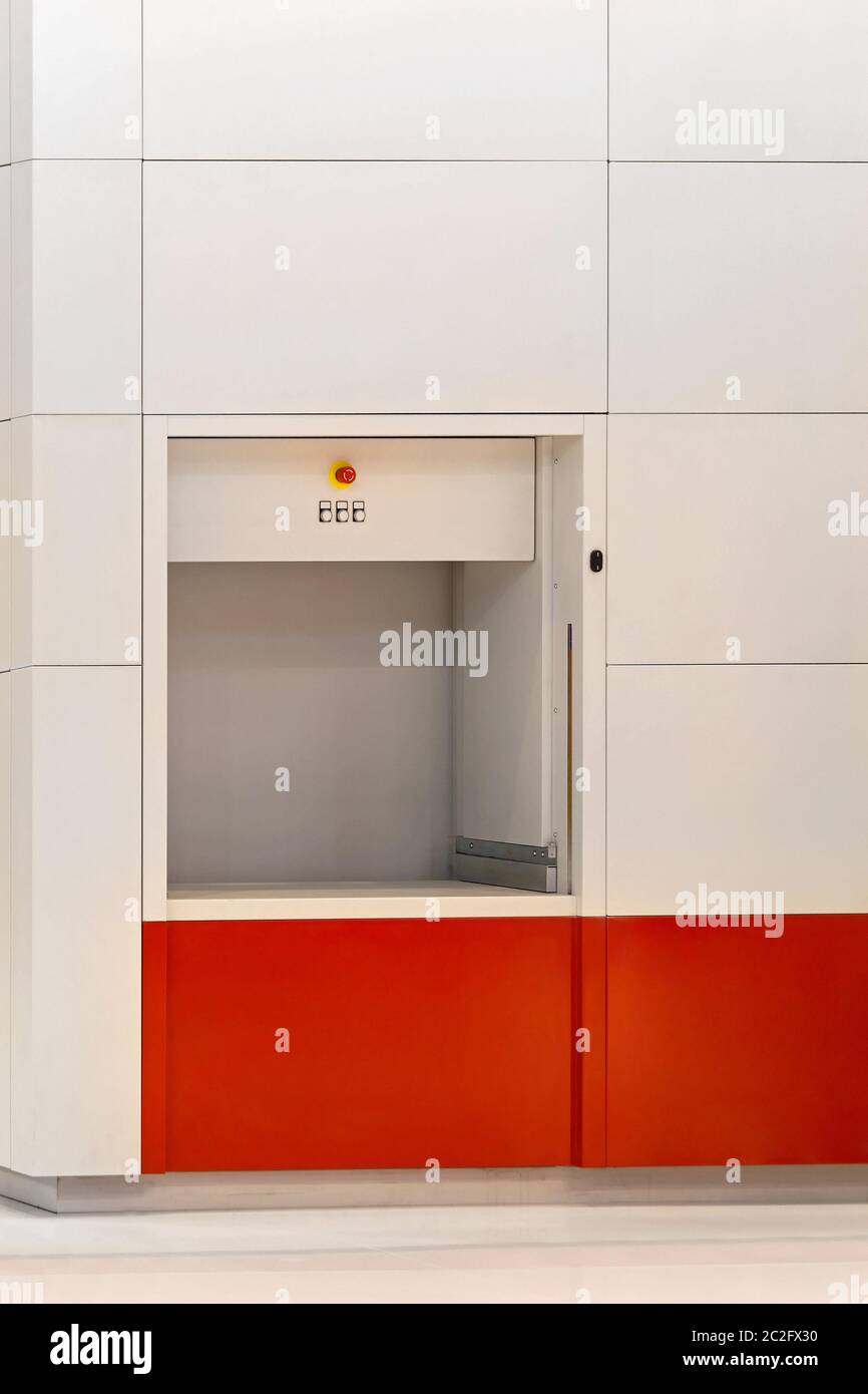 Automated vertical tower storage carousel in warehouse Stock Photo - Alamy