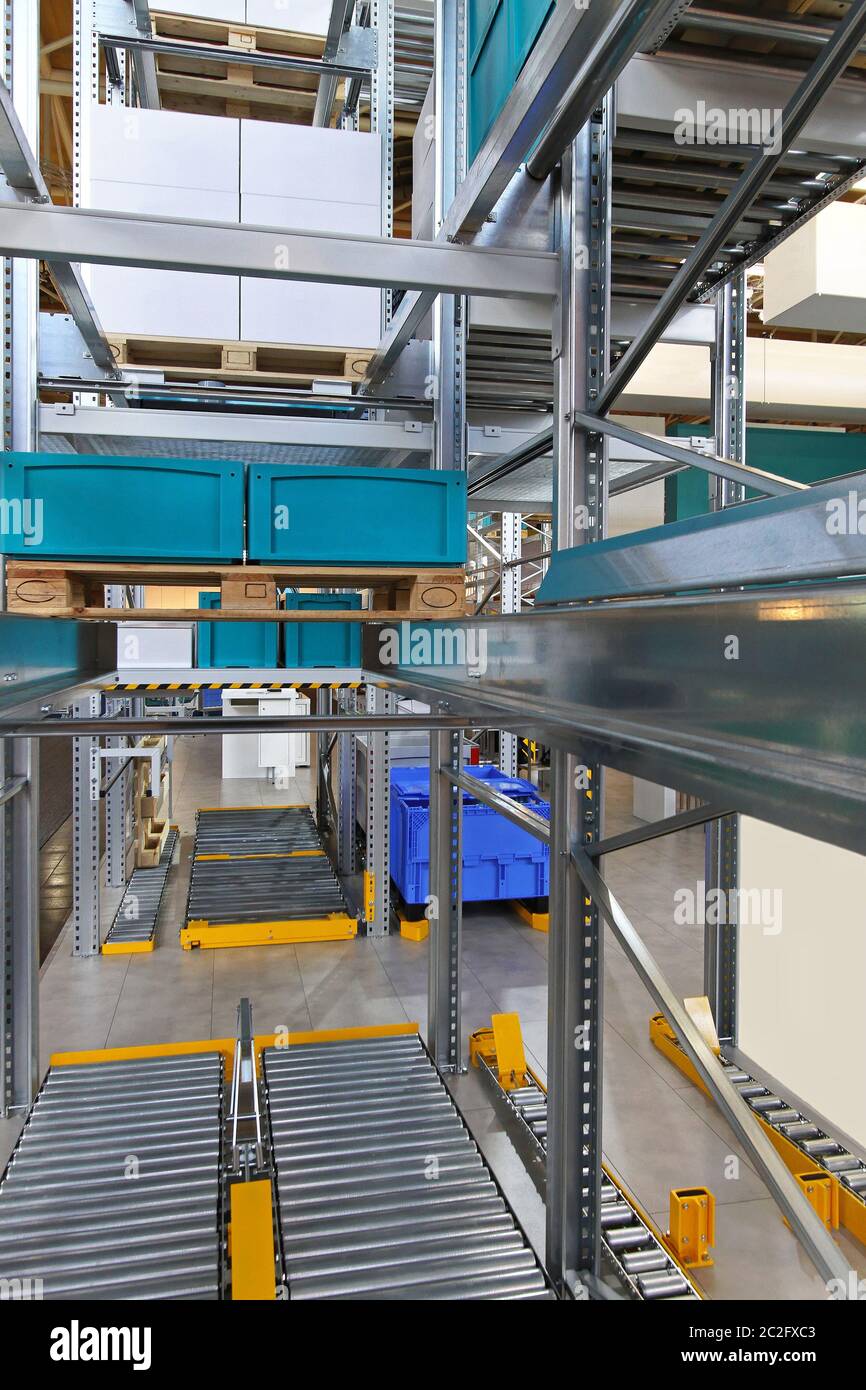 Pallet transport system integrated in racks and shelves Stock Photo - Alamy