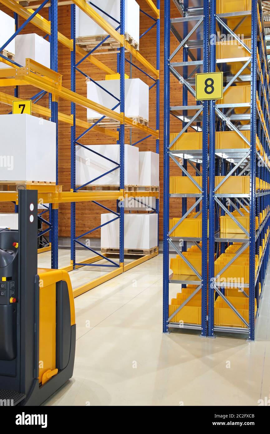 Modern distribution warehouse with high shelving system Stock Photo - Alamy