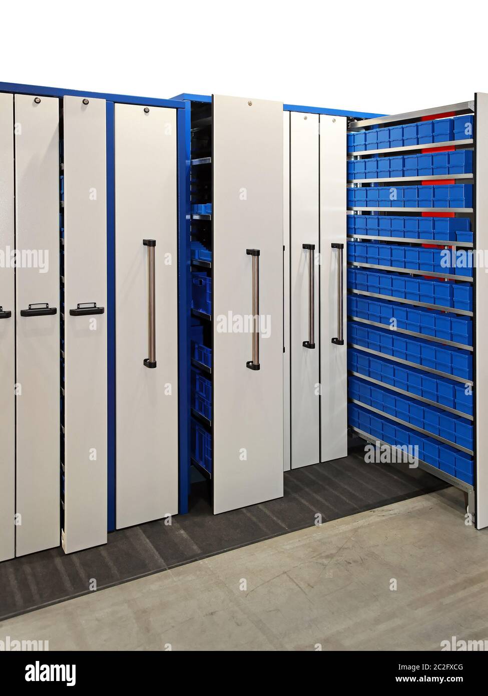 Pull out metal rack lockers in warehouse Stock Photo - Alamy