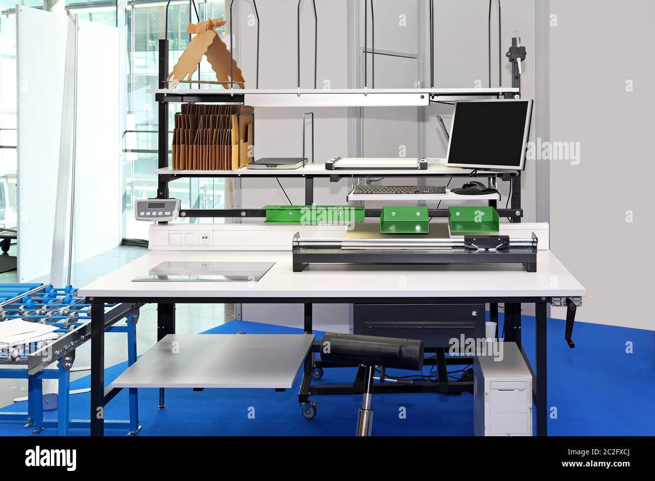 Modern packaging station workplace in distribution warehouse Stock ...