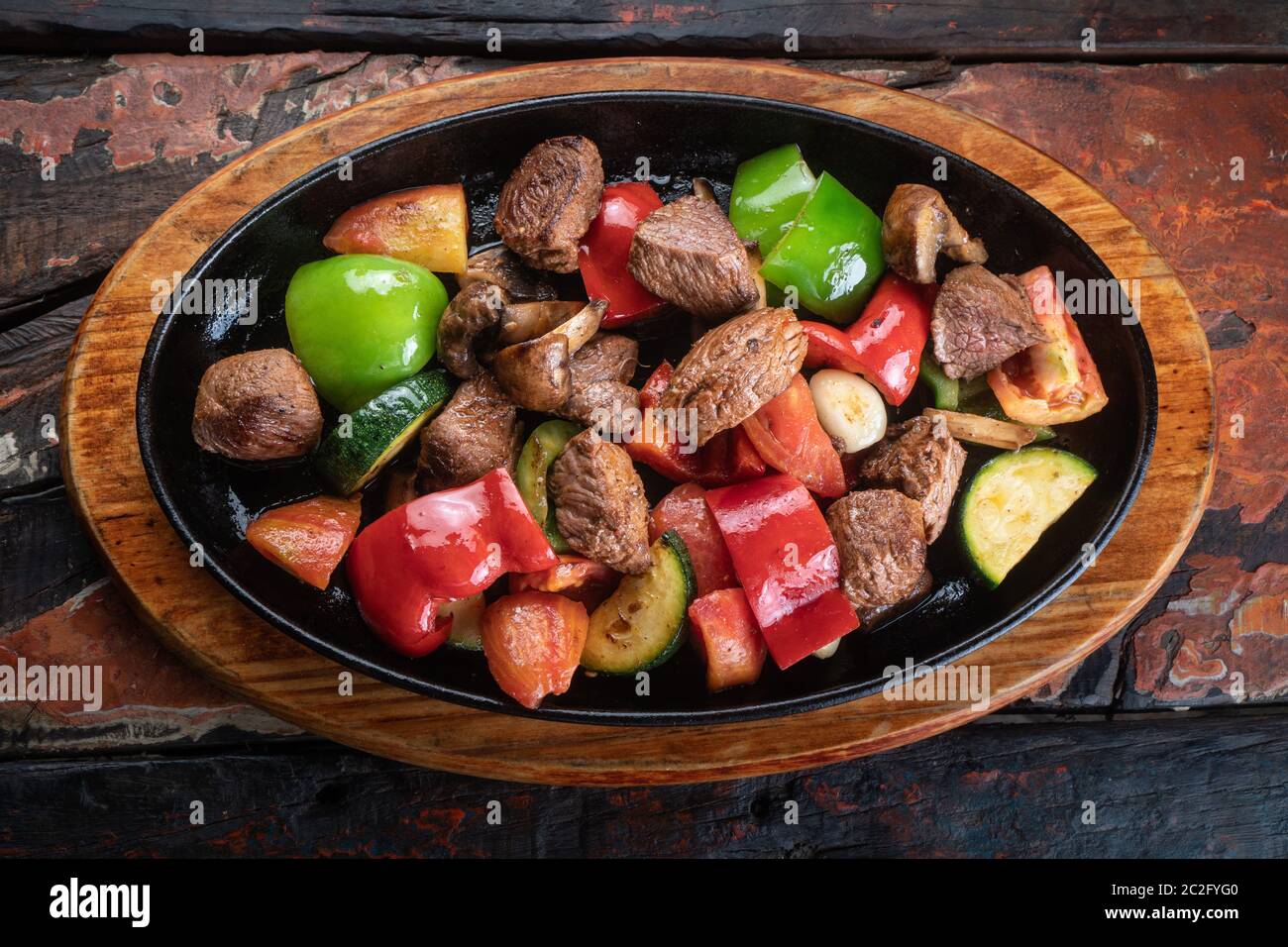 Turkish meat Et Sote isolated on rustic woogen table Stock Photo - Alamy