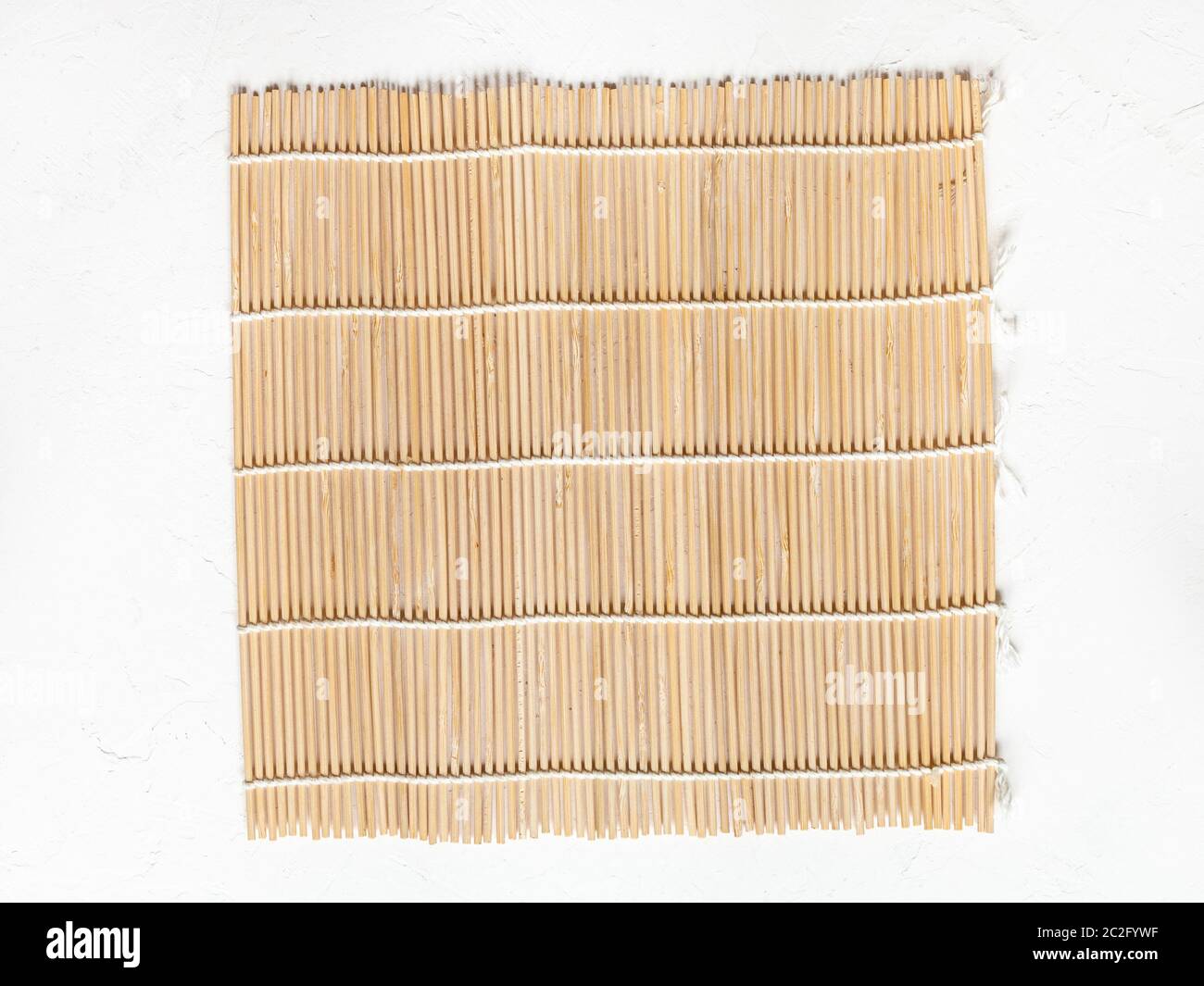 top view of wooden mat made from linden wood sticks on concrete board ...
