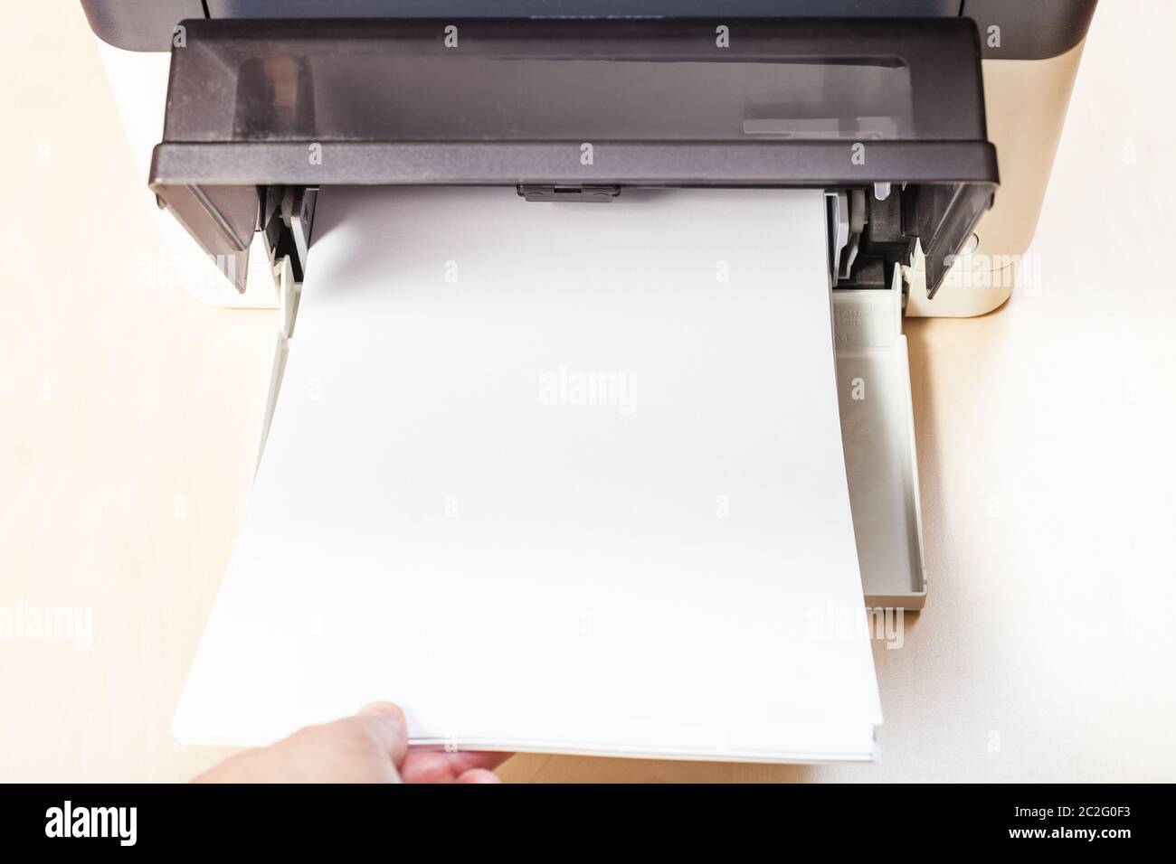loading of blank paper sheets in printer tray of multi function device ...