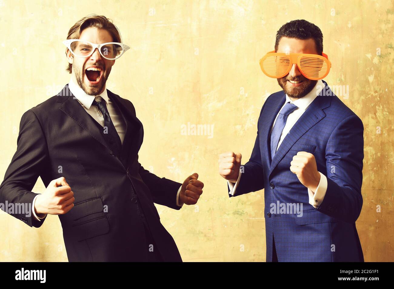 Corporate party in office. Successful happy businessmen in suits and ...