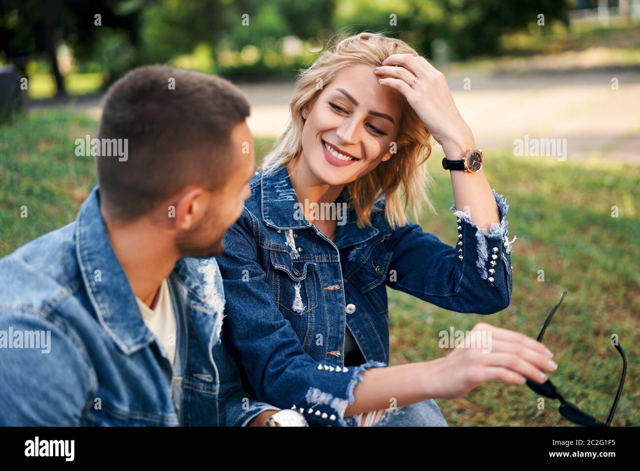Happy couple in love flirting while dating Stock Photo - Alamy