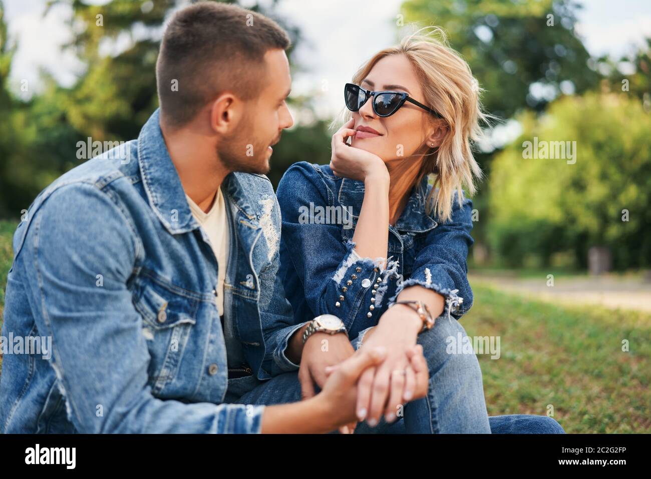 Happy couple in love flirting while dating Stock Photo - Alamy