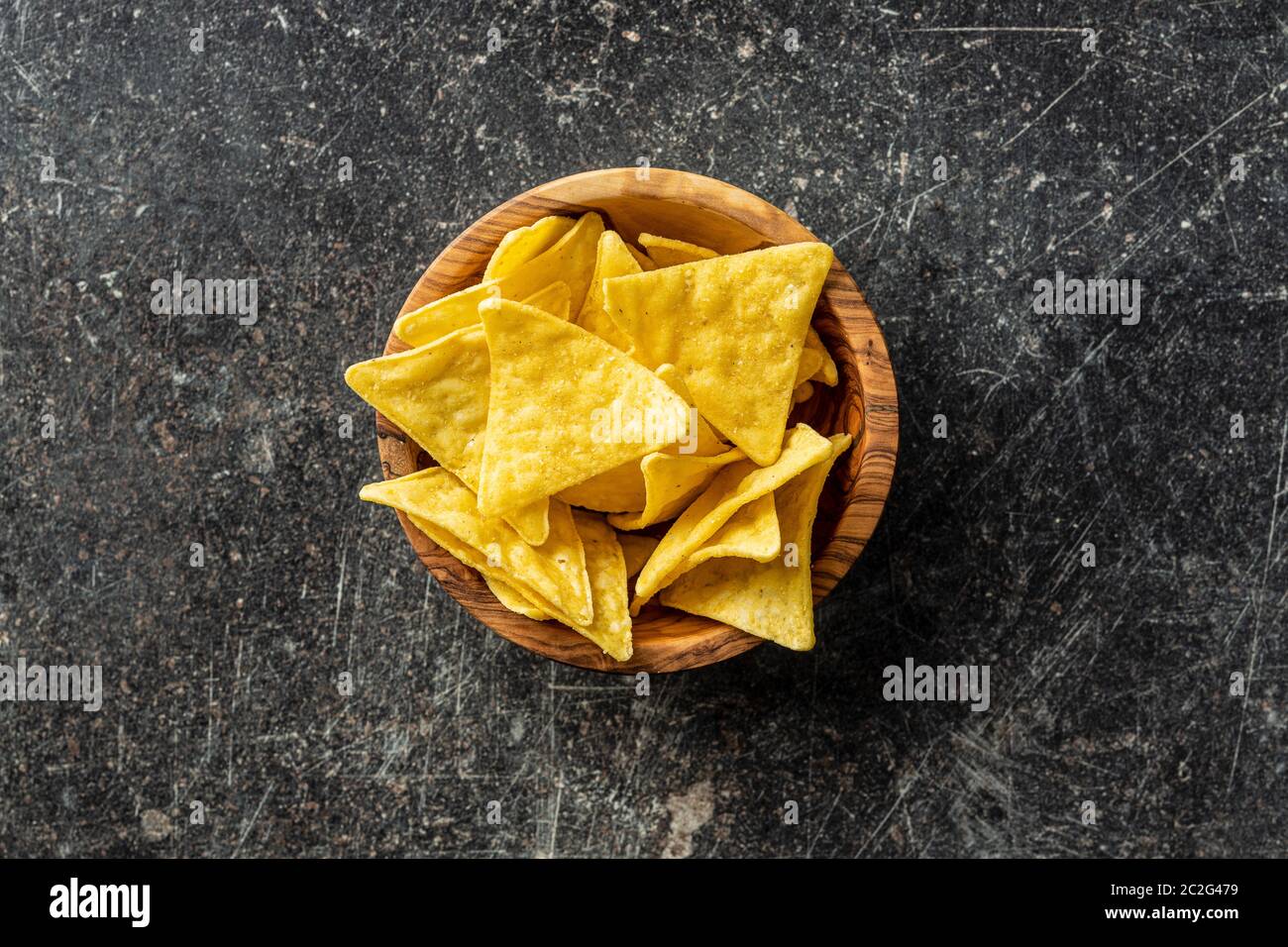 Corn nacho chips. Yellow tortilla chips in wooden bowl. Top view Stock ...