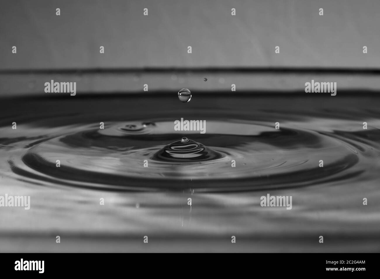 Rain falling on surface water Black and White Stock Photos & Images - Alamy