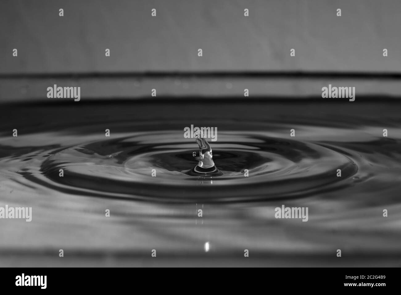 Rain falling on surface water Black and White Stock Photos & Images - Alamy