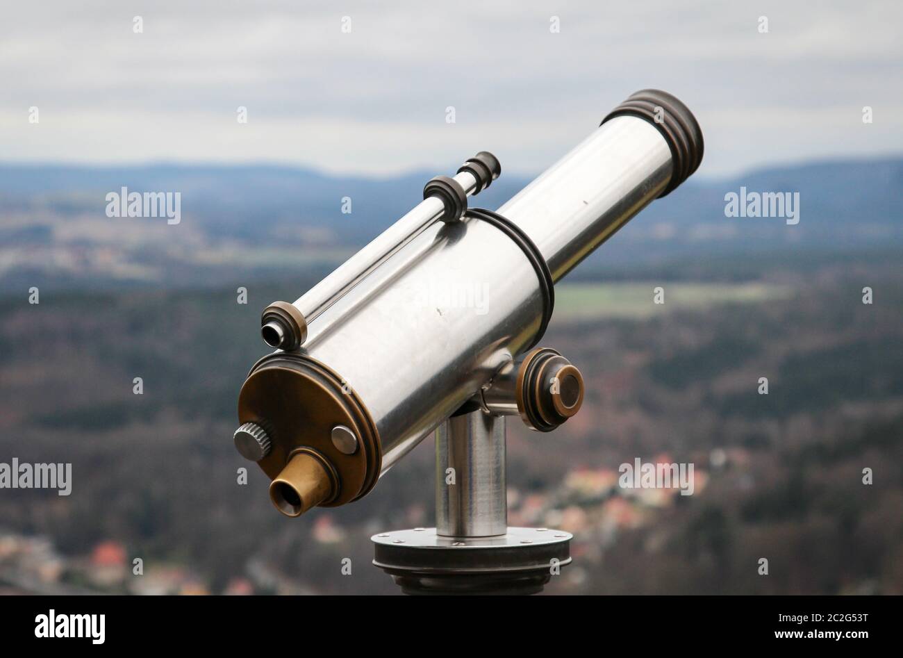 View of a telescope facing a city or landscape Stock Photo - Alamy