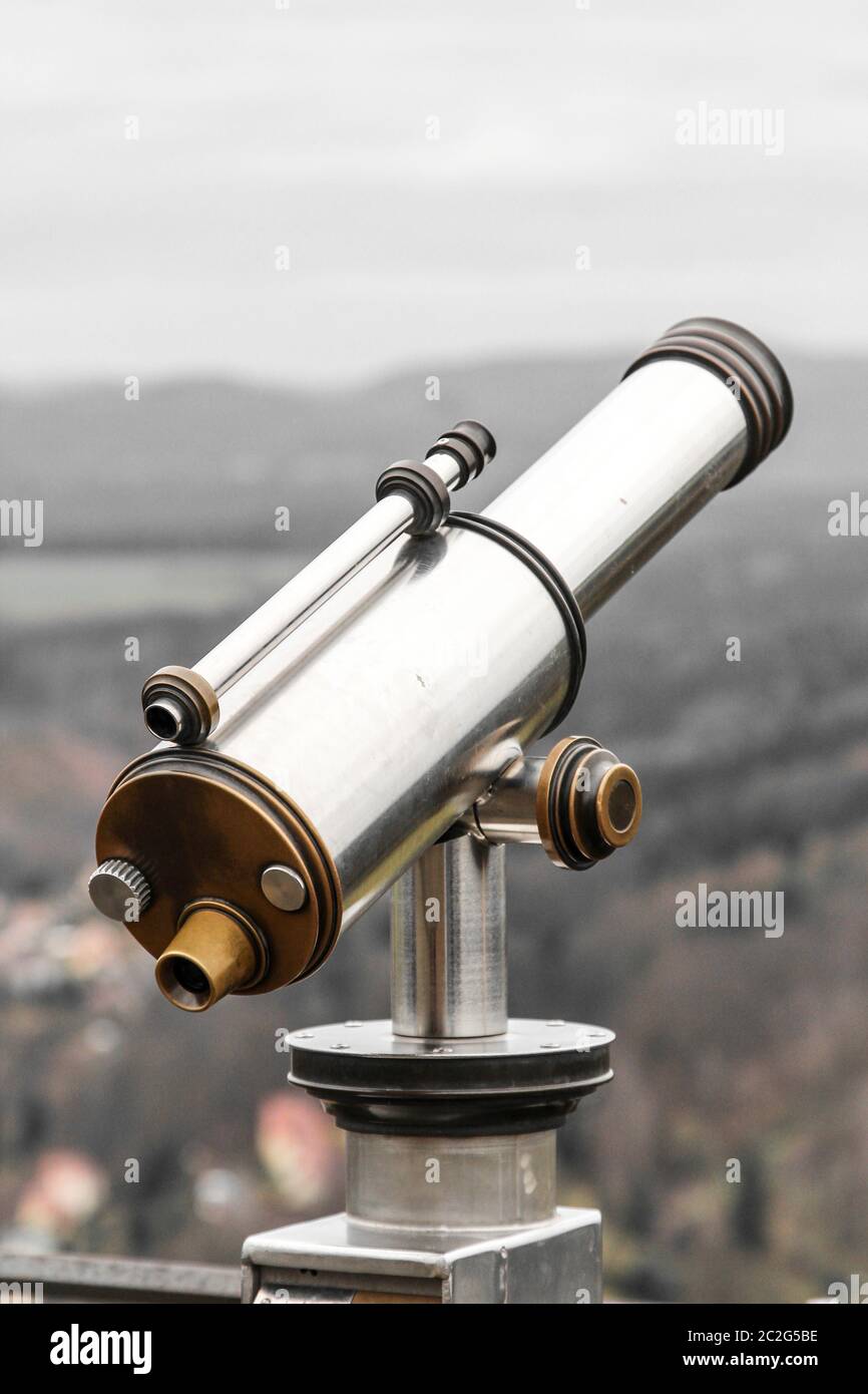 View of a telescope facing a city or landscape Stock Photo - Alamy