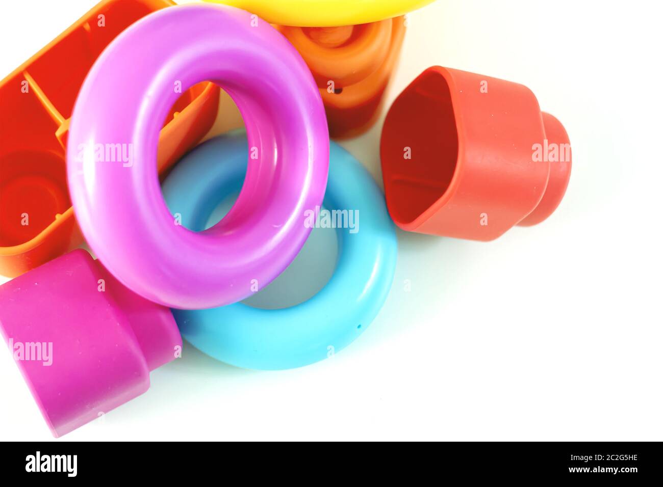 Colored plastic rings and rubber bricks for children to play Stock ...