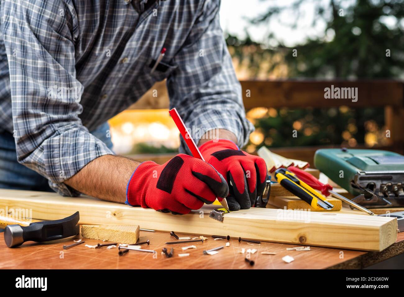 Adult carpenter craftsman takes measure hi-res stock photography and ...