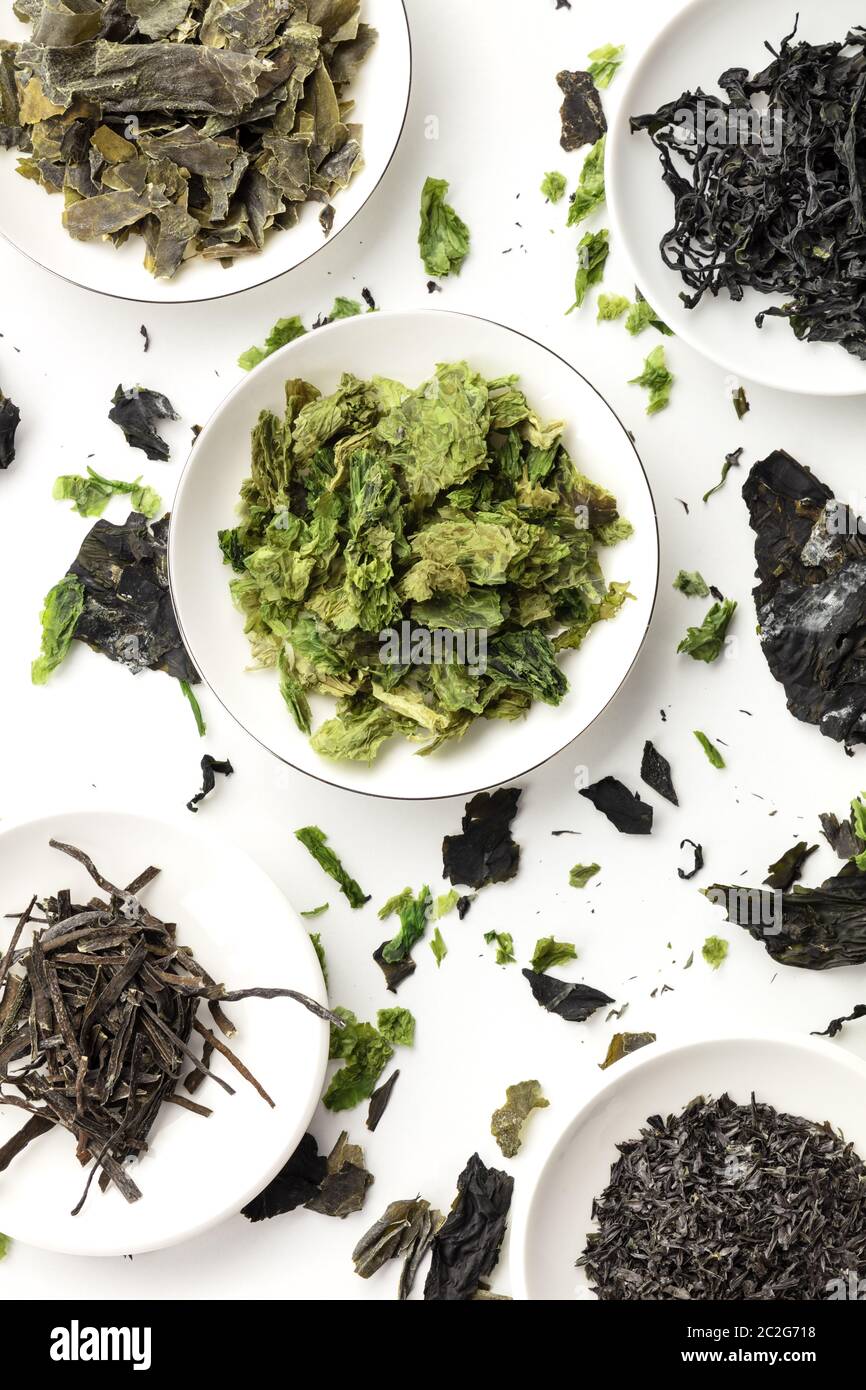 Various dry seaweed, sea vegetables, shot from the top on a white ...