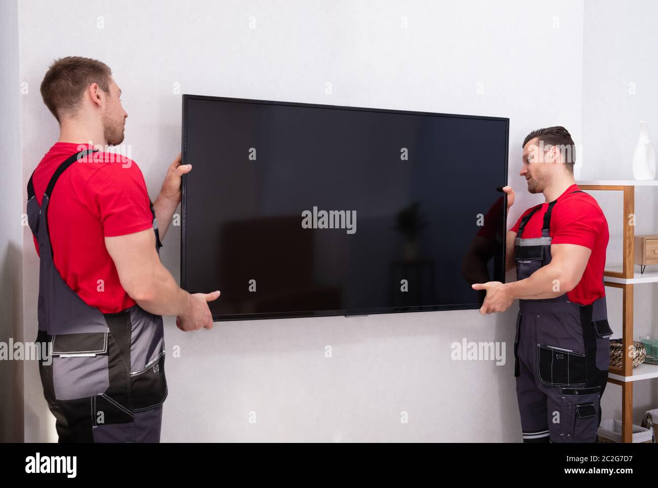 Man working on large wall hi-res stock photography and images - Alamy