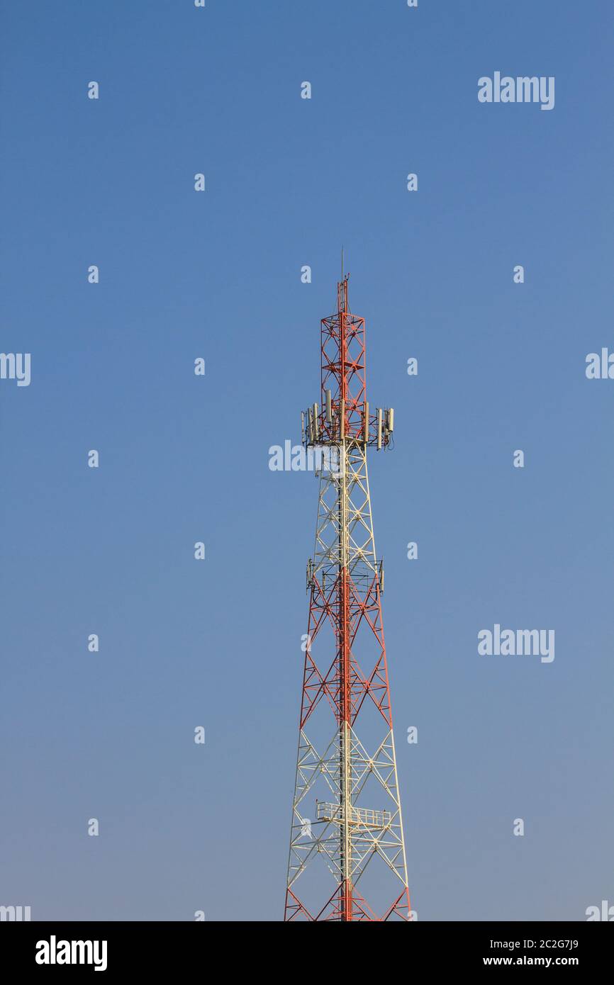 Telecommunication tower for network on blue sky Stock Photo - Alamy