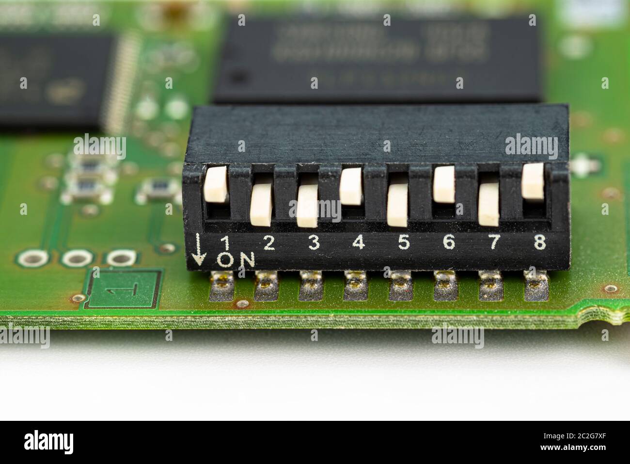 Analog switch on a green printed circuit board with eight positions ...