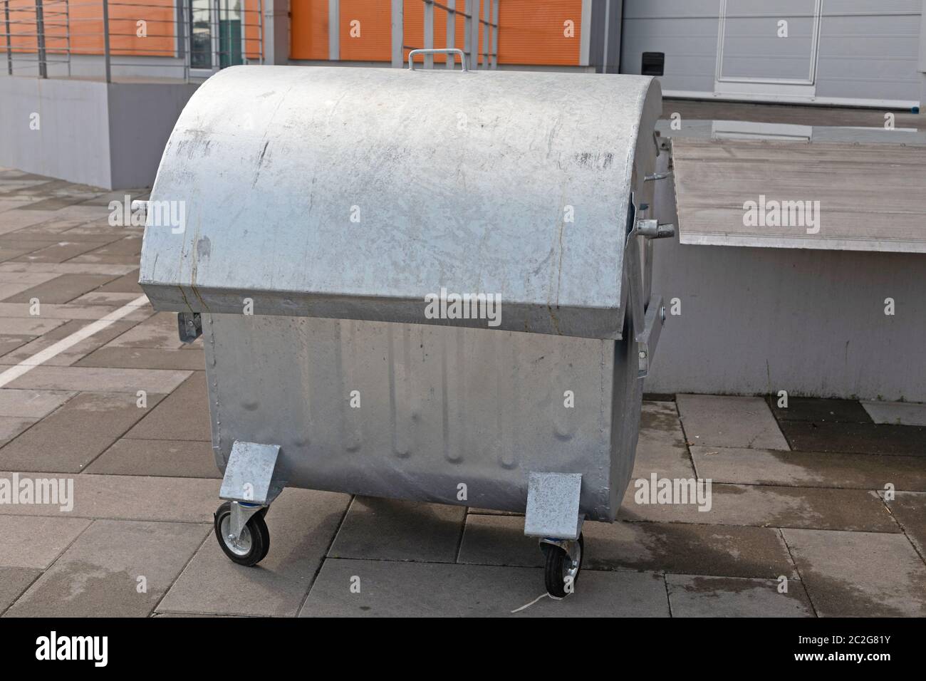 Silver Industrial Dumpster Container in Front of Warehouse Stock Photo ...