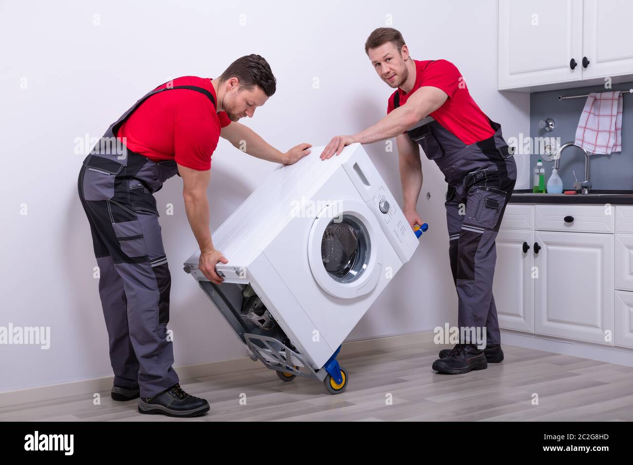 Man carrying washing machine hi-res stock photography and images - Alamy