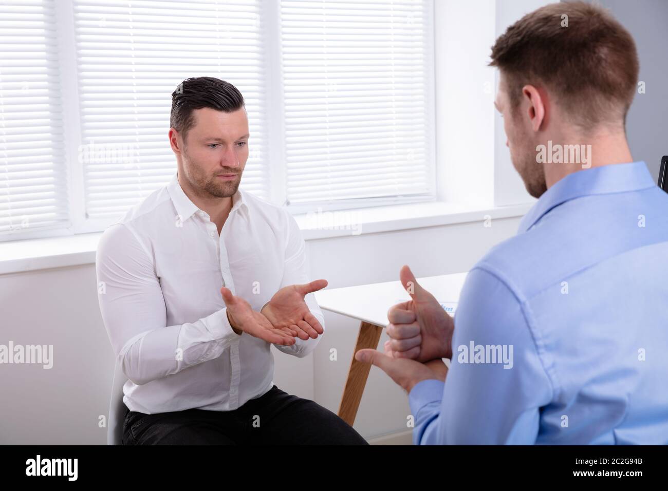 Two Hearing Impaired Friends Using Sign Language For Communication ...