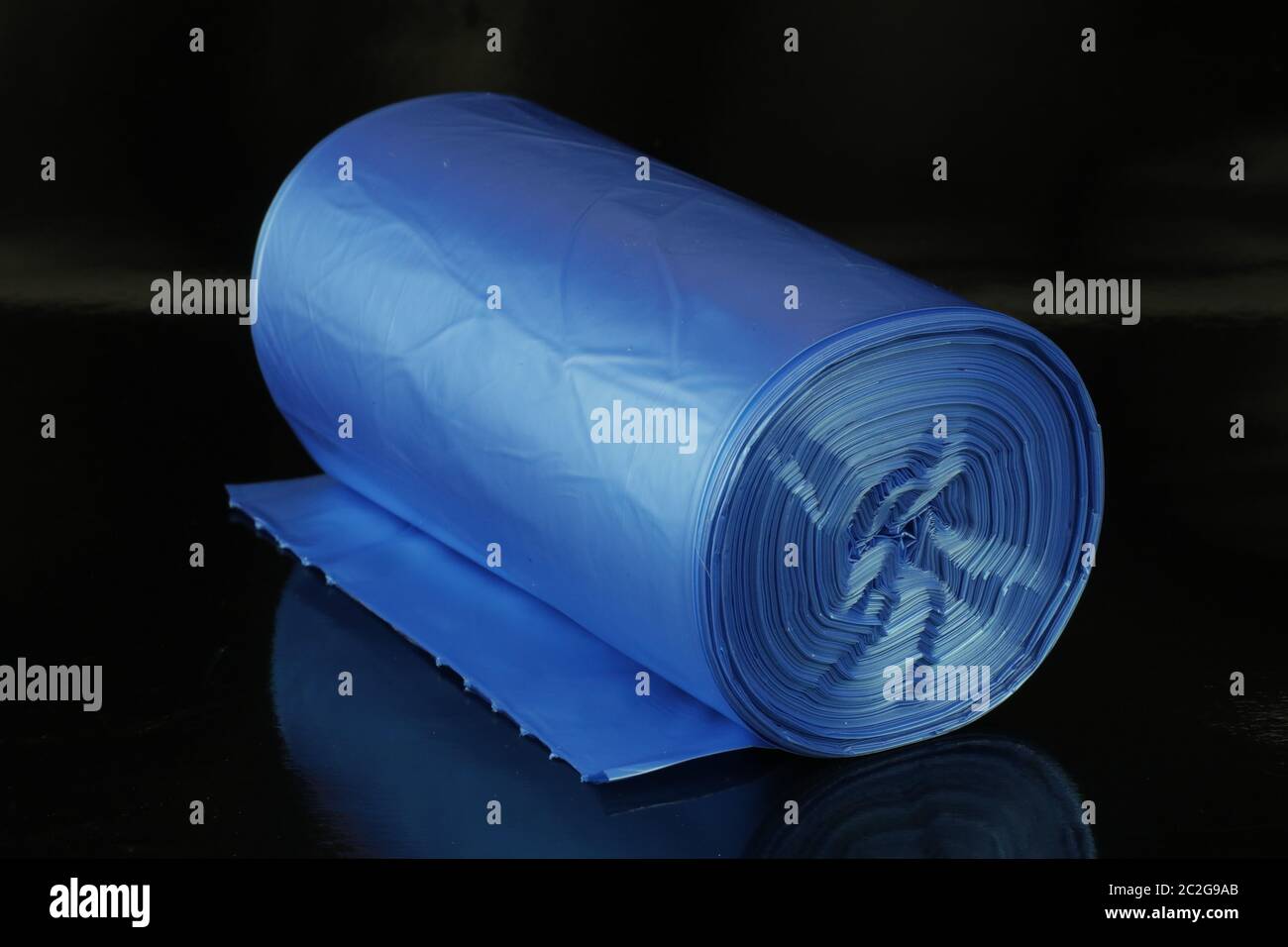 Recycling blue trash bags rolled up for easy use Stock Photo - Alamy