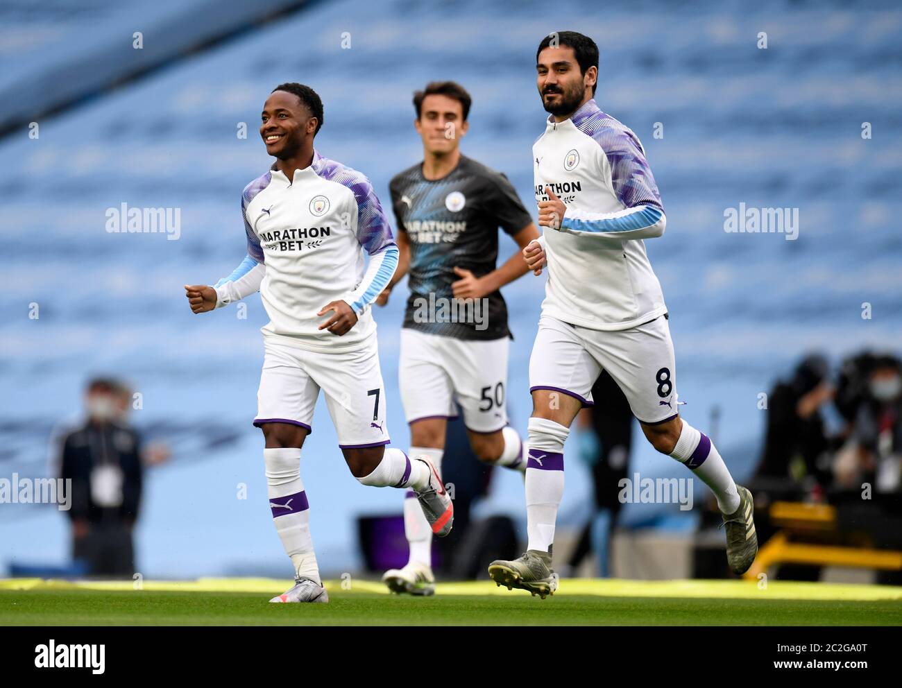 Manchester City's Raheem Sterling and Ilkay Gundogan warm up before the ...