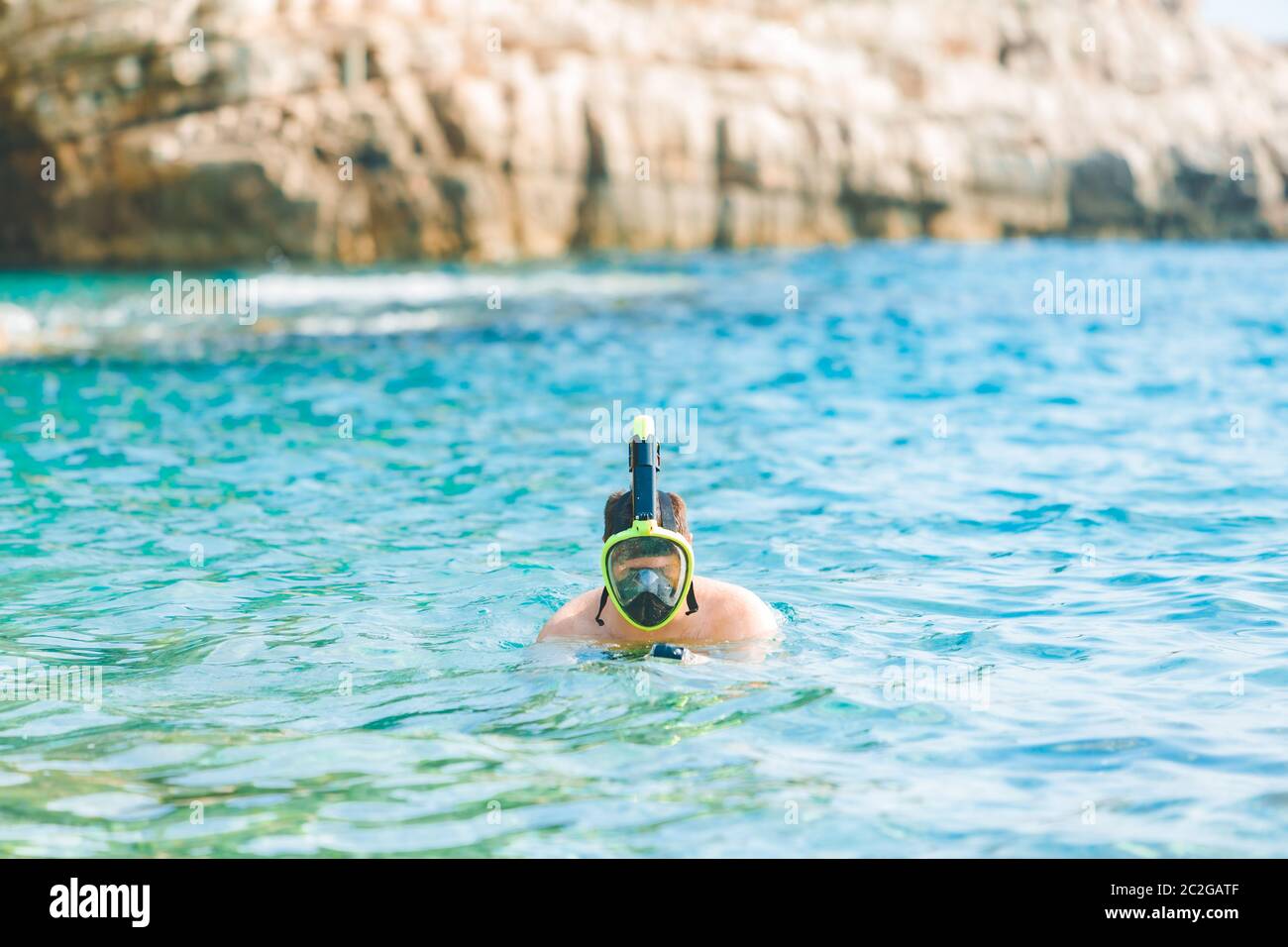 man swimming with snorkeling mask at blue azure sea water Stock Photo ...
