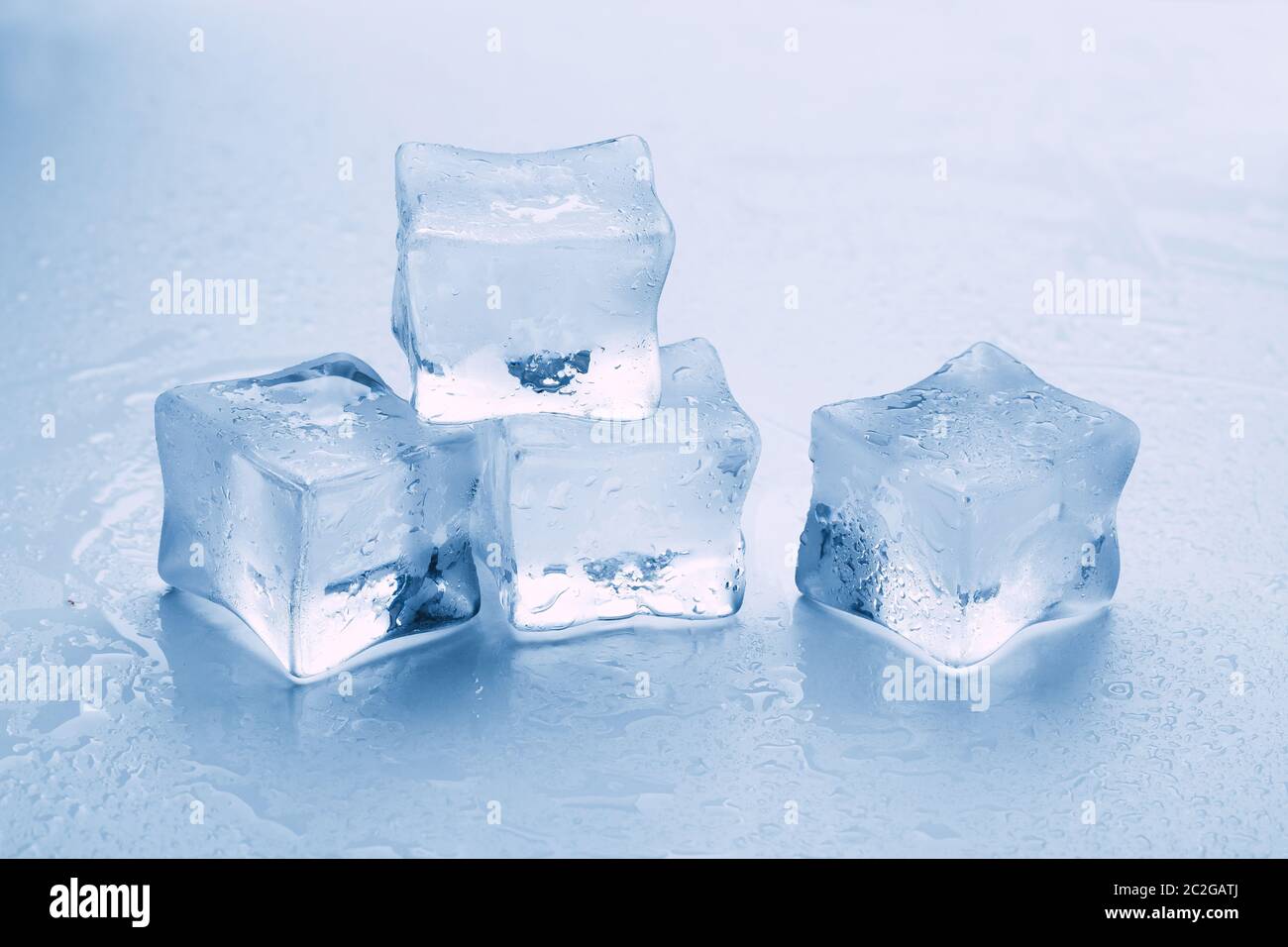 Melted ice cubes close up isolated on white background Stock Photo - Alamy