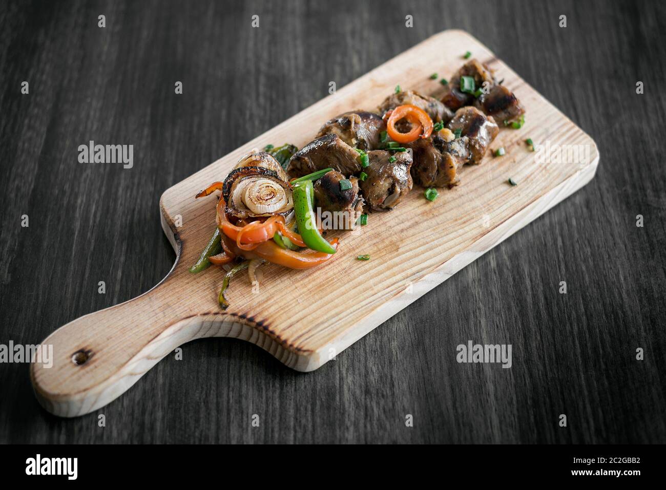 grilled fresh sausage starter tapas snack set on rustic wood board ...