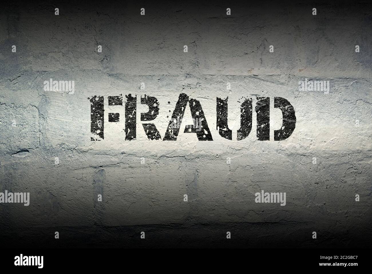 fraud stencil print on the grunge white brick wall Stock Photo - Alamy