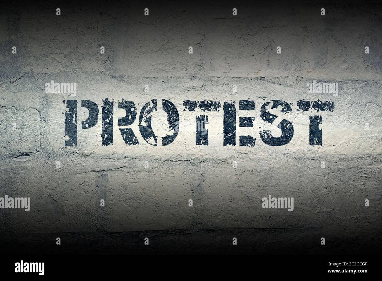 protest stencil print on the grunge white brick wall Stock Photo - Alamy