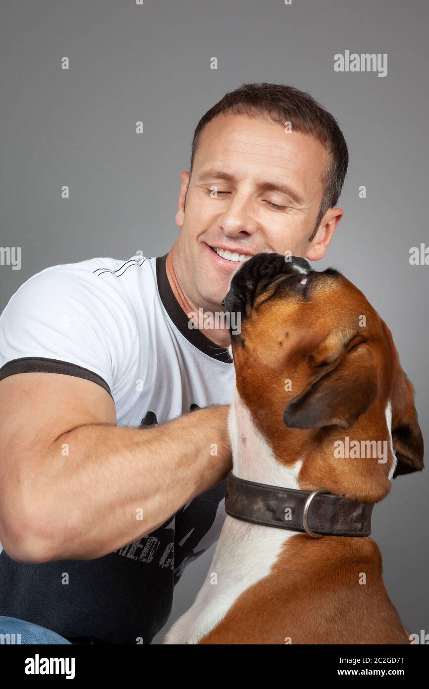 handsome muscle man with his dog Stock Photo - Alamy