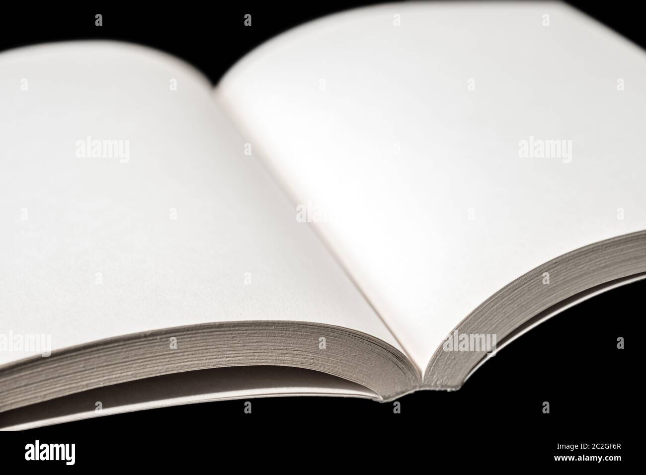 Open blank book mockup on black background Stock Photo - Alamy
