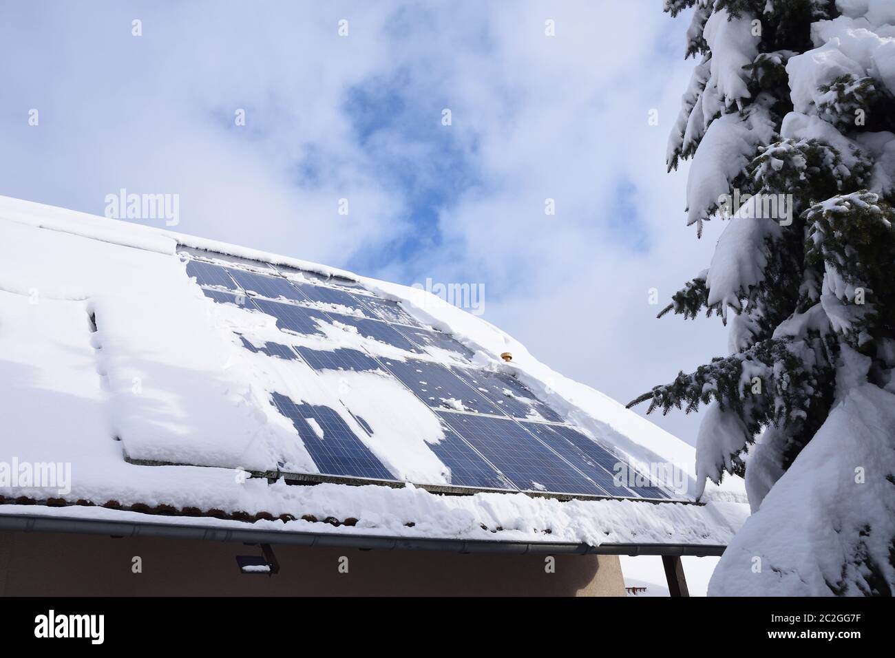 Solar modul in winter on a roof with snow Stock Photo - Alamy