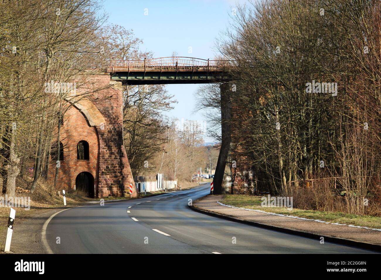 An old former railway bridge over a road Stock Photo - Alamy