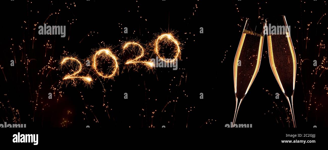 New year 2020 fireworks on night sky with golden champagne Stock Photo ...